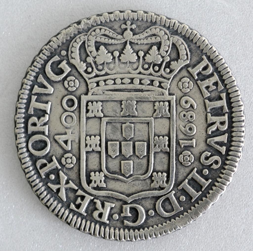 Antiga moeda de prata portuguesa do final do século XVI